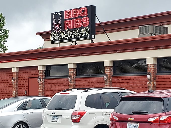 That iconic tower with its sunny yellow logo and palm tree is like a lighthouse for hungry souls—guiding barbecue pilgrims home through the West Virginia hills.
