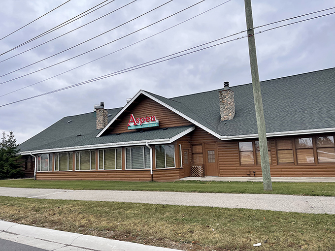 The rustic lodge-like exterior of Aspen Restaurant welcomes hungry travelers with its wooden façade and hanging plants, like a cozy mountain retreat transplanted to Macomb.