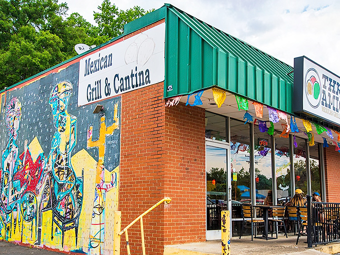 The vibrant mural outside Three Amigos sets the tone – authentic Mexican cuisine lives behind this unassuming brick façade in Charlotte.