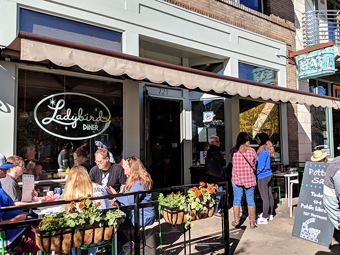 The turquoise chairs outside Ladybird Diner aren't just seating—they're an invitation to slow down and savor life one pancake at a time.