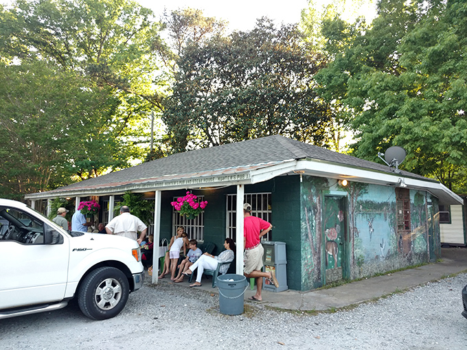 The unassuming exterior of Hunters Pub might fool you—but those hanging flower baskets and packed porch are telltale signs of culinary greatness within.