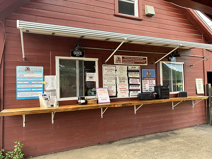 The unassuming red farm stand that houses ice cream dreams—proof that the best things in life rarely need neon signs or fancy facades.