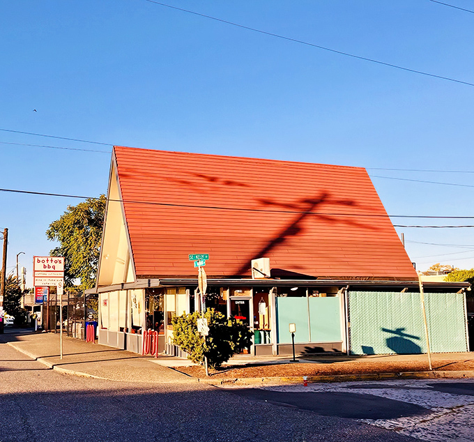 The A-frame architecture isn't just eye-catching—it's a smoke signal to barbecue lovers that something magical awaits inside this Portland landmark. 