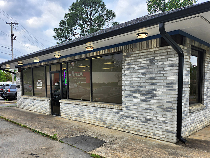 The unassuming storefront where donut dreams come true. Blue skies above, sweet treasures within—North Little Rock's hidden gem awaits.