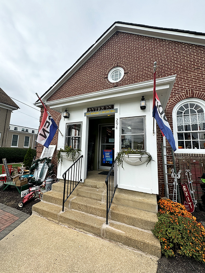 The charming brick exterior of Aunt Margaret's beckons with its round window and vintage lanterns—like a time portal disguised as a building.