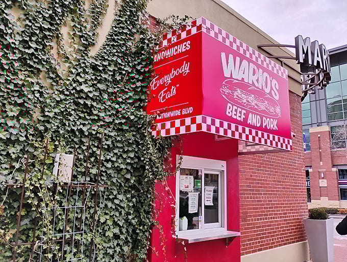 The unassuming brick exterior of Wario's might not scream "food destination," but that red checkered sign is like a beacon for sandwich aficionados across Columbus.