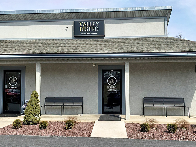 Valley Bistro's unassuming exterior hides culinary treasures within, like finding a Michelin-worthy meal in your neighbor's garage. Those manicured shrubs are just the appetizer.