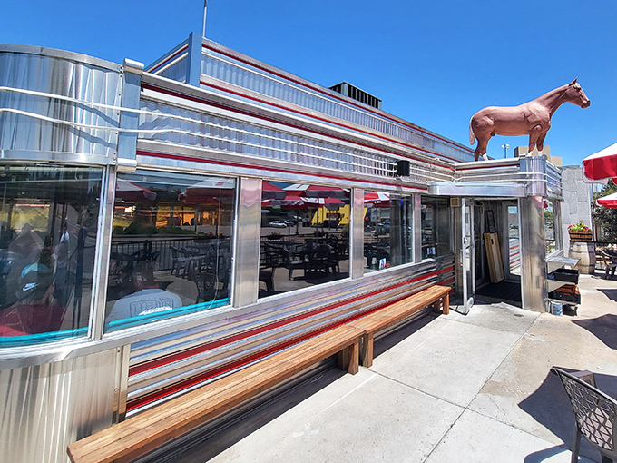 That iconic neon cowboy isn't just showing you where to eat – he's been inviting hungry travelers to pull over since Eisenhower was president.
