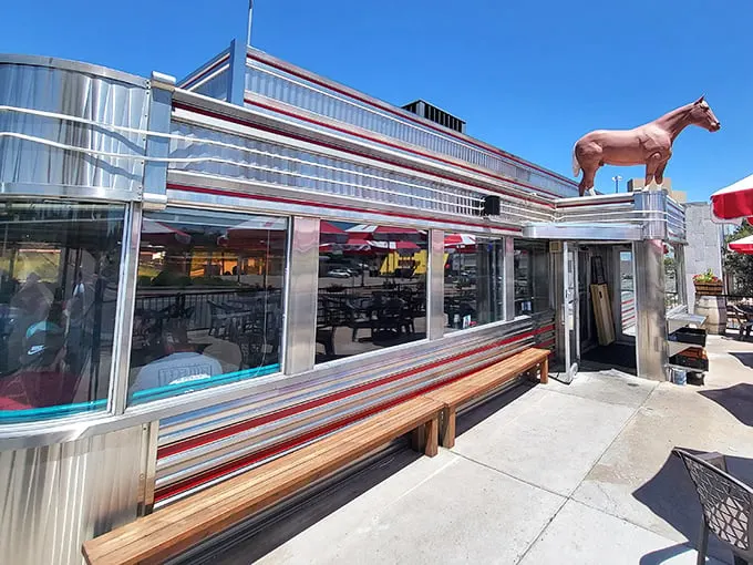That iconic neon cowboy isn't just showing you where to eat – he's been inviting hungry travelers to pull over since Eisenhower was president.