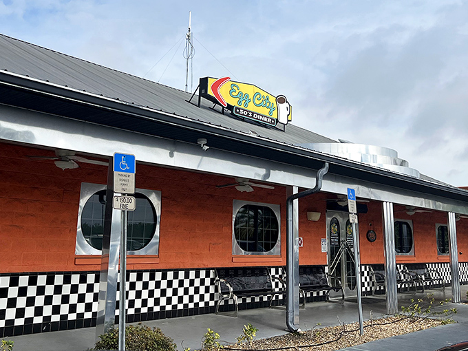 The vibrant orange exterior with its classic checkered trim isn't just eye-catching—it's a beacon of breakfast hope for hungry travelers on Florida's highways.