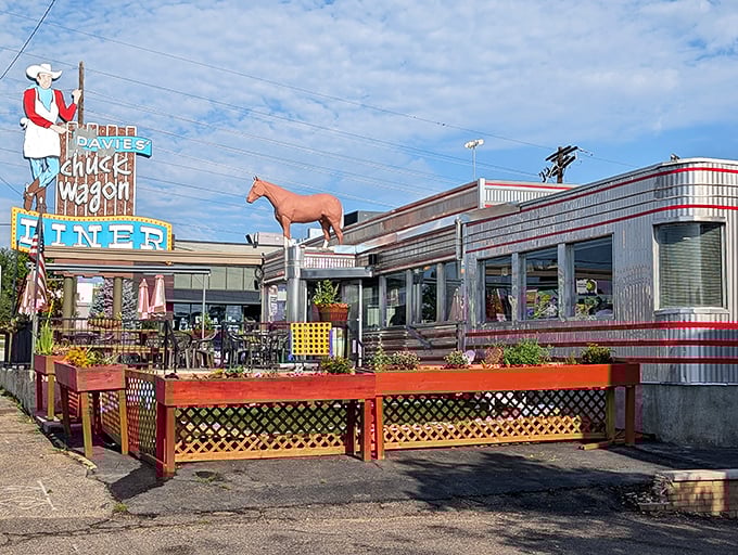 That iconic neon cowboy isn't just showing you where to eat – he's been inviting hungry travelers to pull over since Eisenhower was president.