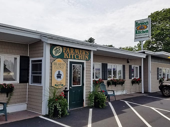The unassuming exterior of The Farmer's Kitchen stands like a culinary lighthouse in Farmington, promising comfort food treasures within those shingled walls.