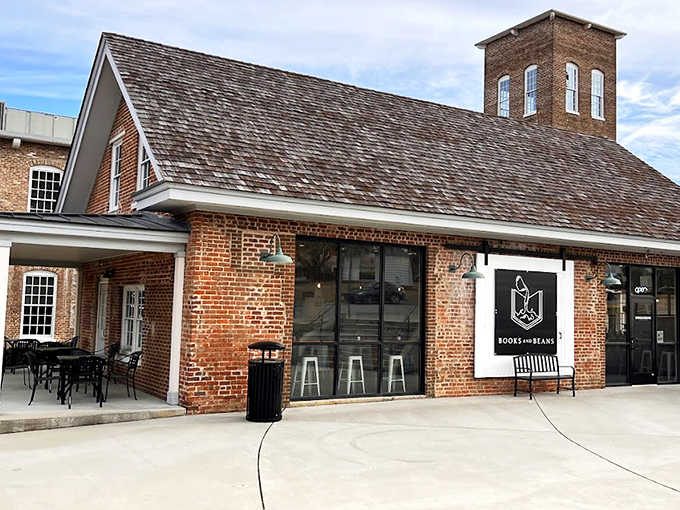 The architectural equivalent of a perfect first date: charming brick exterior, wooden shingle roof, and the promise of books and caffeine inside.