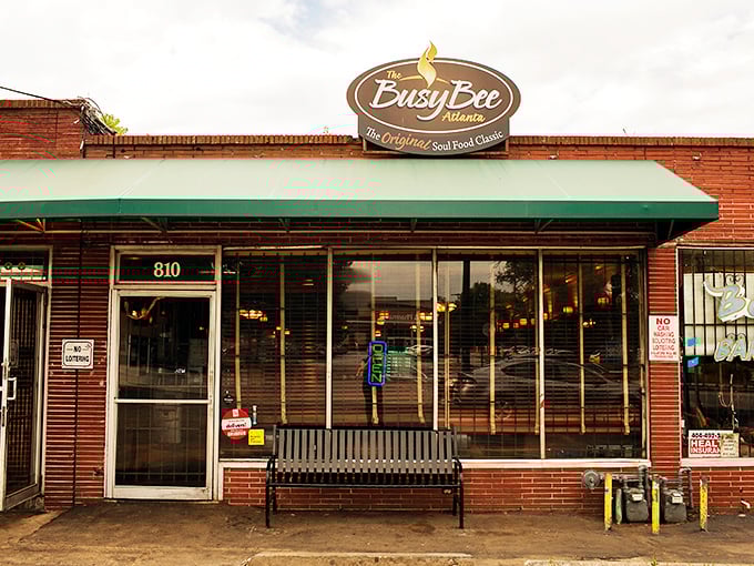 The iconic yellow Busy Bee sign beckons hungry souls like a soul food lighthouse on Atlanta's MLK Drive. History and flavor await inside.