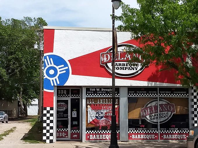The red, white, and blue exterior isn't subtle, but neither is the barbecue inside. Kansas pride meets smoky perfection at this Wichita landmark.