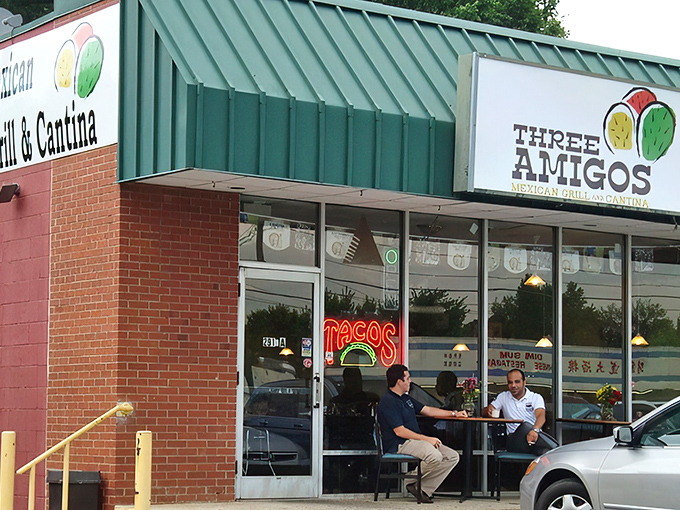 The vibrant mural outside Three Amigos sets the tone – authentic Mexican cuisine lives behind this unassuming brick façade in Charlotte.