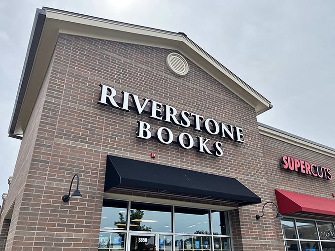The brick façade of Riverstone Books stands like a literary lighthouse, beckoning bibliophiles with its simple, elegant signage against the blue Pittsburgh sky.
