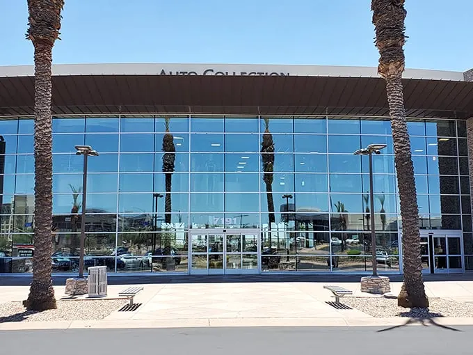 The sleek glass façade of Penske Racing Museum gleams in the Arizona sun, palm trees standing guard like pit crew members awaiting their champions.