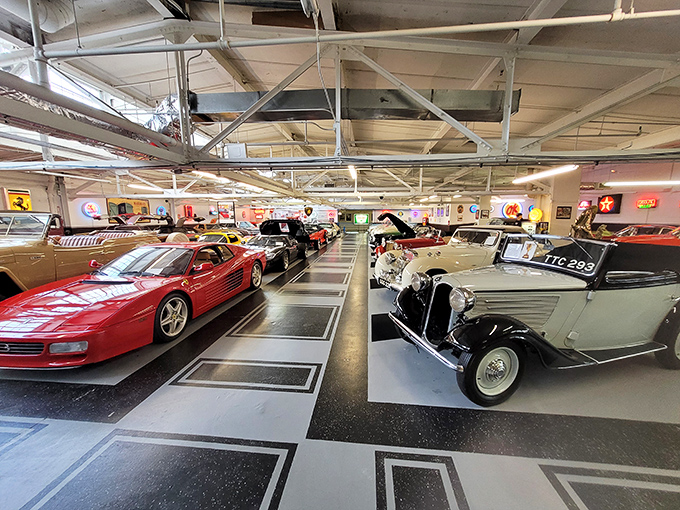Ferrari meets vintage elegance in this automotive paradise. The checkerboard floor adds a touch of racing nostalgia to this incredible collection.