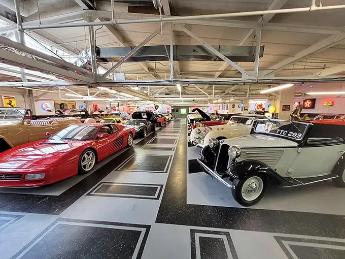Ferrari meets vintage elegance in this automotive paradise. The checkerboard floor adds a touch of racing nostalgia to this incredible collection.