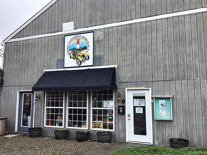 The unassuming gray exterior hides automotive treasures like your grandmother's secret recipe box—except instead of cookies, you'll find Cadillacs.