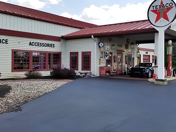 The vintage Texaco gas station façade welcomes visitors like a portal to America's automotive golden age, complete with those iconic red pumps.