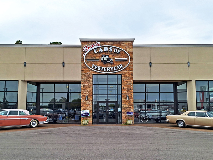 The stone-accented entrance to Swope's Cars of Yesteryear Museum stands like a portal to automotive history, promising chrome-plated treasures within.