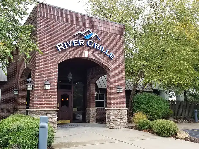 The brick façade of River Grille stands like a culinary fortress, promising treasures within that make the journey to Bentonville worthwhile.