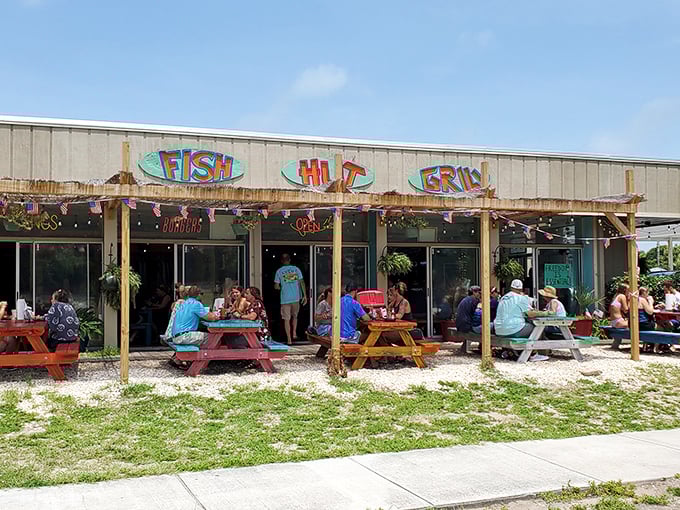 Fish Hut Grill’s laid-back vibe is pure coastal bliss—picnic tables, fresh catch, and sunny smiles all around.