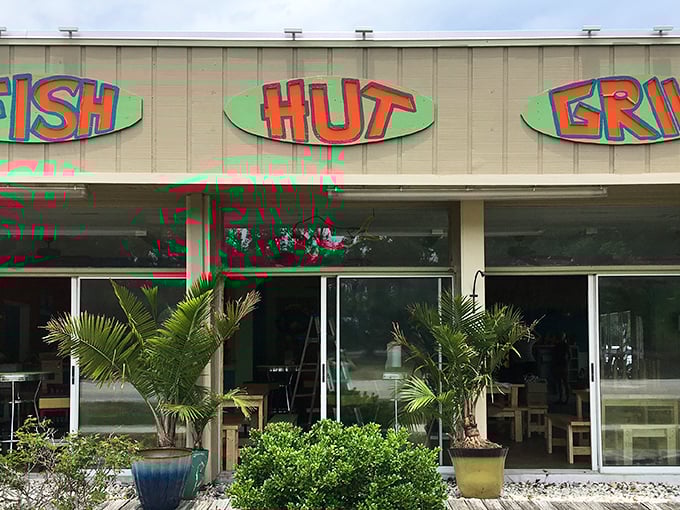 Fish Hut Grill’s laid-back vibe is pure coastal bliss—picnic tables, fresh catch, and sunny smiles all around.