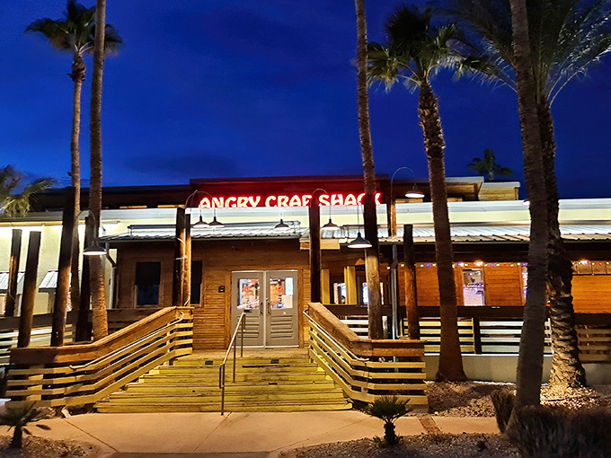 Palm trees and wooden ramps welcome you to seafood paradise—where the desert meets the ocean at Angry Crab Shack's inviting Henderson location.