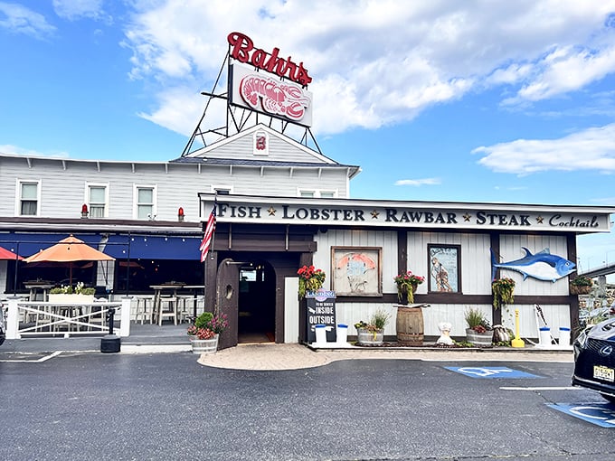 The iconic red "RESTAURANT" sign at Bahrs Landing isn't just advertising—it's a beacon of hope for seafood lovers navigating the Jersey Shore in search of their next great meal.