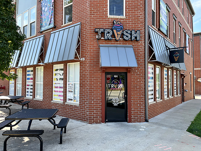 TRVSH's brick corner location in downtown Bentonville beckons with its distinctive metal awnings and inviting picnic tables—architectural foreplay for the flavor explosion waiting inside.