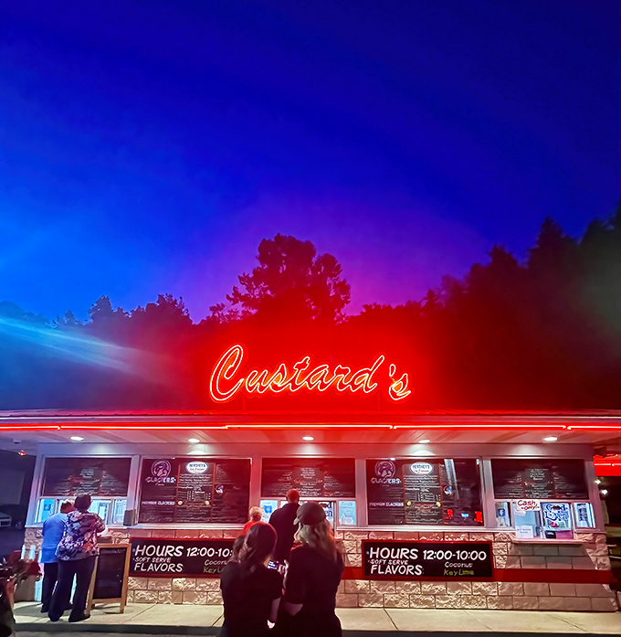 The neon glow of Custard's against the twilight sky isn't just advertising—it's a beacon calling all dessert pilgrims home.