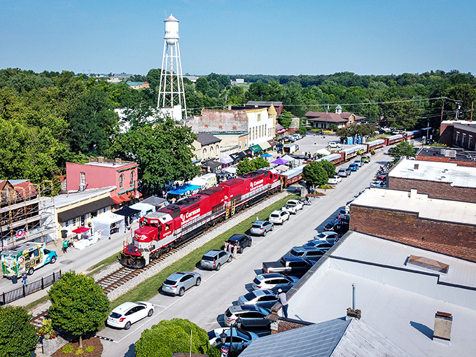 The quintessential small-town moment: a bright red locomotive rumbling past historic storefronts. Midway's railroad heritage isn't just preserved—it's still very much alive!