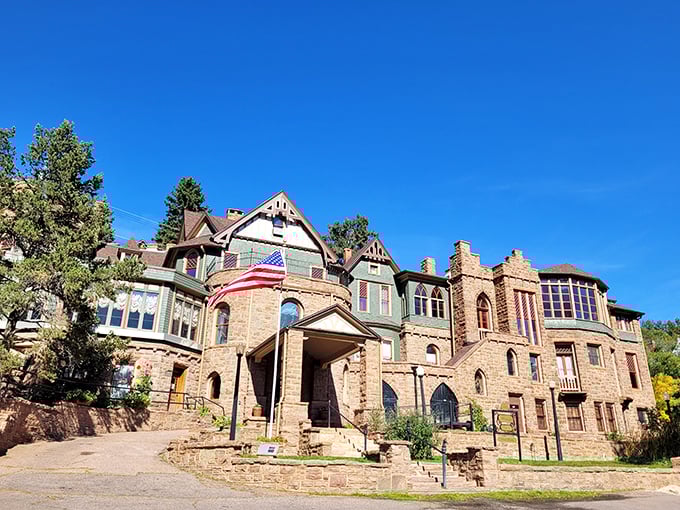 Miramont Castle rises from the Colorado landscape like an architectural fever dream, blending nine different styles into one magnificent stone masterpiece.