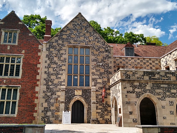 The façade of Salisbury House combines red brick and flint-speckled limestone in a Tudor masterpiece that makes Iowa feel decidedly more Downton Abbey than downtown Des Moines.