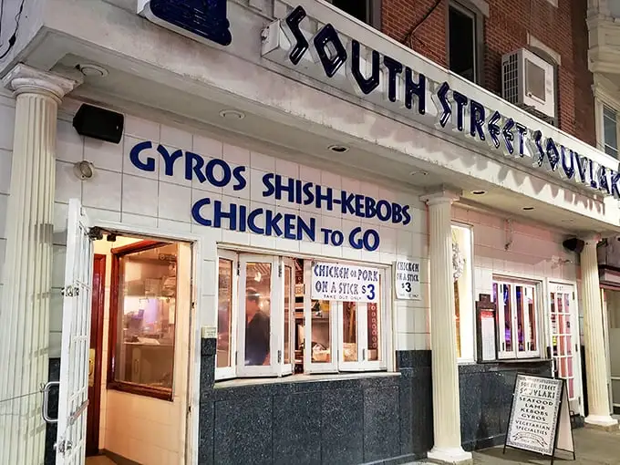 The iconic blue and white façade of South Street Souvlaki stands out like a Mediterranean beacon on Philadelphia's eclectic South Street. Greek paradise awaits!
