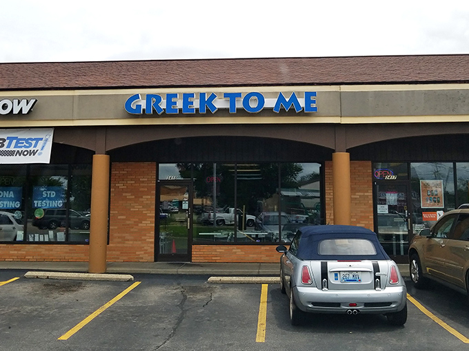 The bright blue sign beckons like a Mediterranean lighthouse in a sea of strip mall sameness. Kentucky's answer to Athens awaits inside.