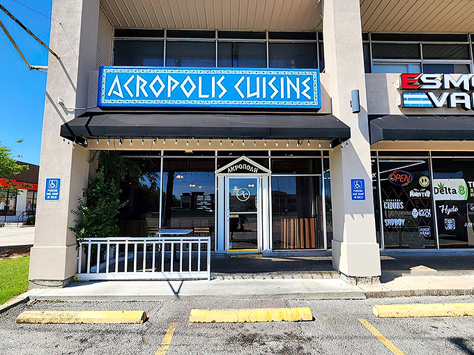 The bright blue sign of Acropolis Greek Cafe stands out like a Mediterranean beacon in New Orleans, promising authentic Greek flavors just steps away.