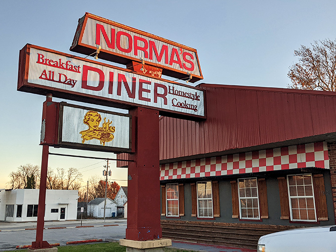 The iconic red exterior of Norma's Diner stands as a beacon of breakfast hope along Joplin's streets, promising homestyle cooking that's worth every mile of the journey.
