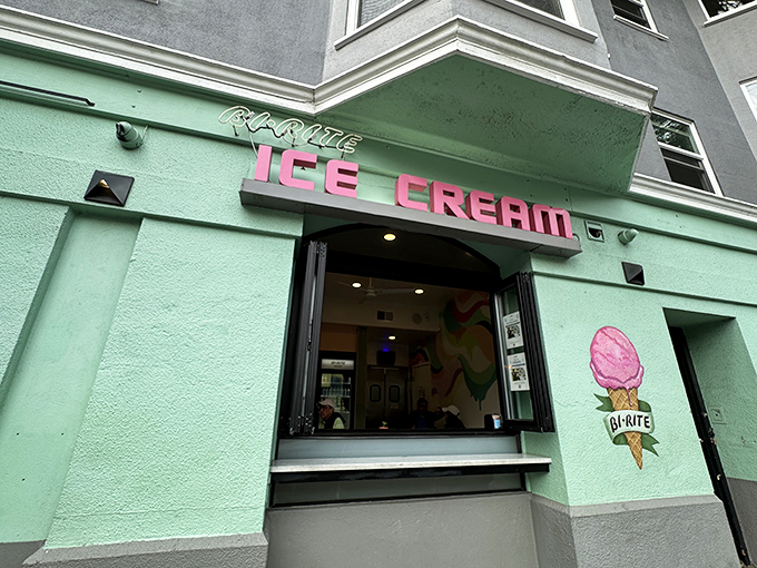 The mint-green facade with its vintage neon sign beckons like a siren song. San Francisco's ice cream pilgrimage site glows invitingly against the evening sky.