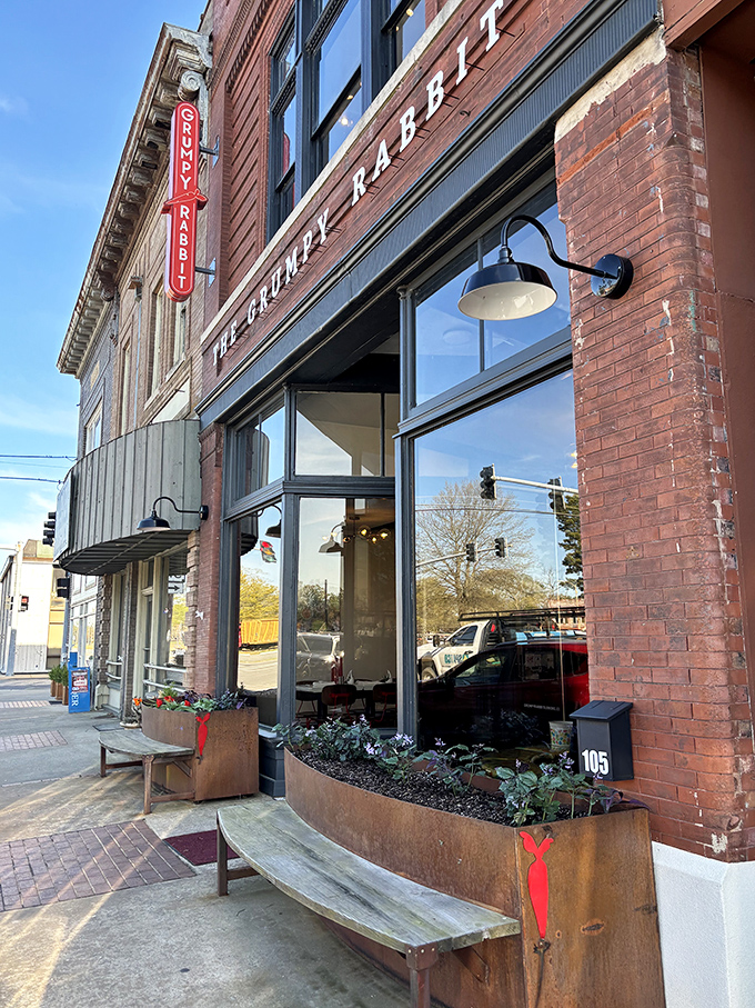 The historic brick facade of The Grumpy Rabbit stands proudly on Lonoke's main street, its vintage charm belying the culinary adventure waiting inside.