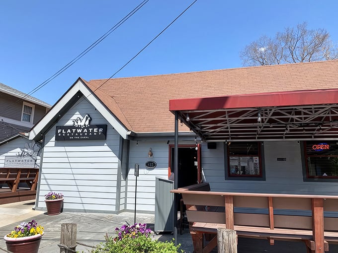 The unassuming exterior of Flatwater belies the culinary treasures within—like finding a Michelin-starred chef cooking in your neighbor's garage.