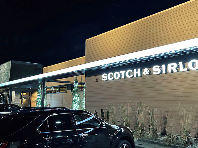 The iconic entrance to Scotch & Sirloin, where those stone lions aren't just guarding the door—they're keeping the vegetarians at bay.