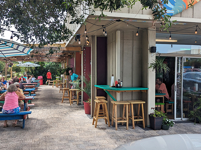 Fish Hut Grill’s laid-back vibe is pure coastal bliss—picnic tables, fresh catch, and sunny smiles all around.