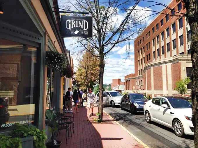 The unassuming storefront of The Grind beckons from Morgantown's brick sidewalks like a caffeine-fueled lighthouse for weary travelers.