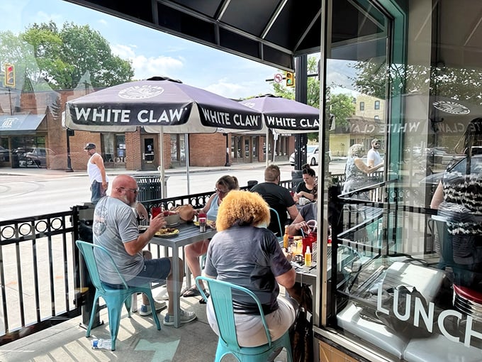 The black awning says it all: "BREAKFAST CURES ALL." At Hang Over Easy, they're not just making a promise—they're offering salvation by spatula.