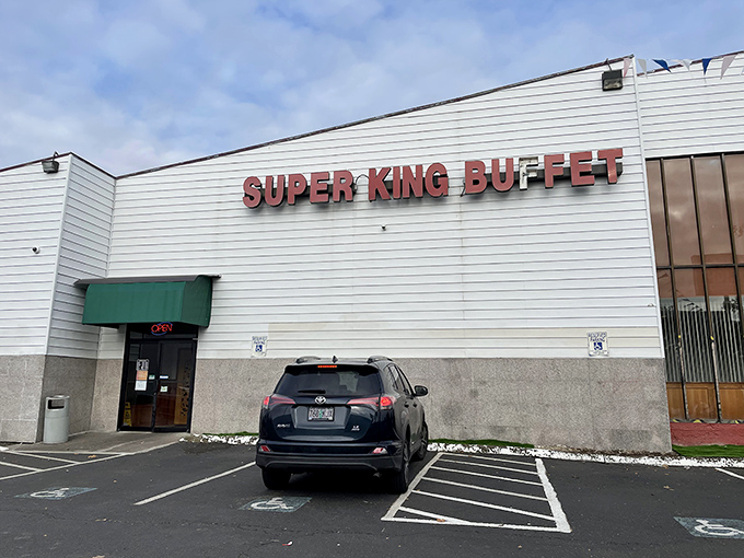 The unassuming exterior of Super King Buffet stands like a culinary fortress, promising treasures within that the modest façade cleverly conceals from passing traffic. 