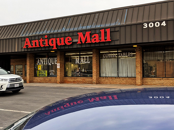 The unassuming brick facade hides a universe of treasures inside—like finding Narnia in a strip mall parking lot.